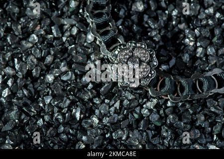 Photo of golden set with gems over dark background Stock Photo - Alamy