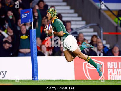 South Africa's Kurt-Lee Arendse (right) with England's Jonny May during ...