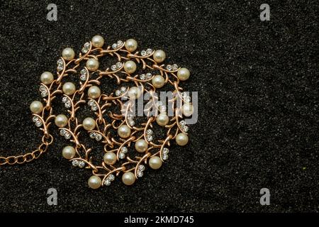 Photo of golden set with gems over dark background Stock Photo - Alamy