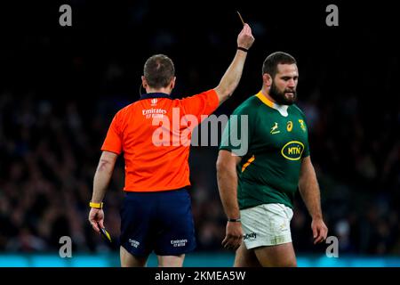 Referee Angus Gardner shows a red card to South Africa's Pieter-Steph ...