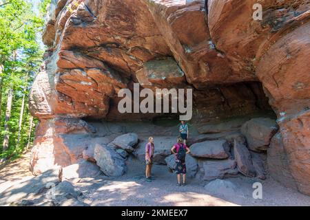 Vosges (Vogesen) Mountains: cave Grotte du Brotsch, hiker in Alsace ...