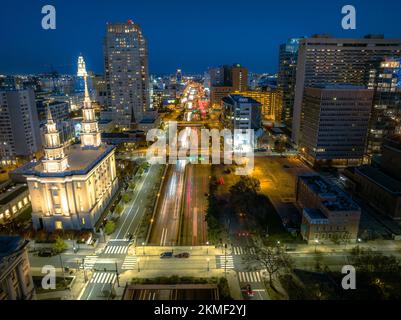 A drone shot of skyscrapers and a wide highway in Philadelphia in the ...