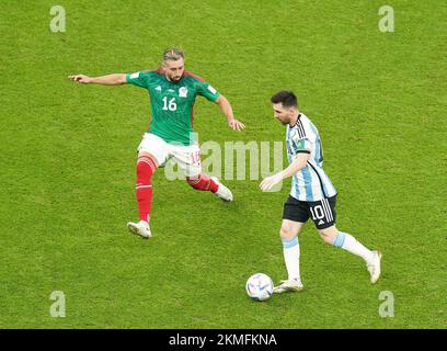 Argentina's Lionel Messi (left) and Mexico's Nestor Araujo battle for ...