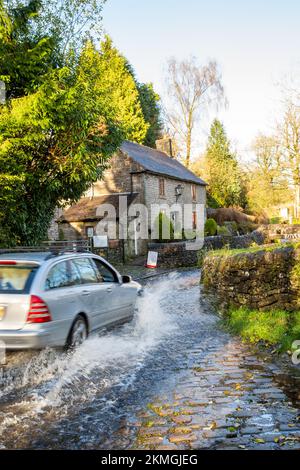 Hoo Brook flowing through the ford over the cobbled main street in the ...