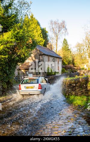 Hoo Brook flowing through the ford over the cobbled main street in the ...