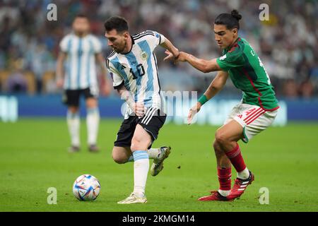 Argentina's Lionel Messi (left) and Mexico's Hirving Lozano battle for ...