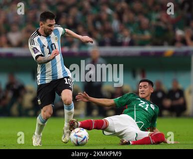 Argentina's Lionel Messi (left) and Mexico's Hirving Lozano battle for ...
