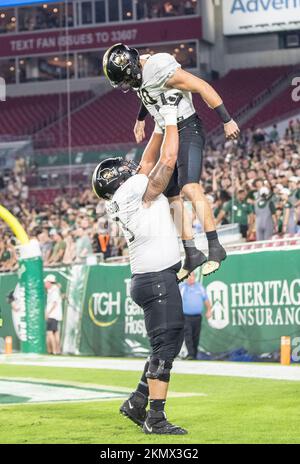 UCF quarterback John Rhys Plumlee (10) runs past South Florida ...