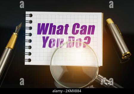 Business and Economics. On the black surface is a pen, a magnifying ...