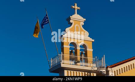 Panagia church, orange steeple, Greek national flag, electricity pole ...