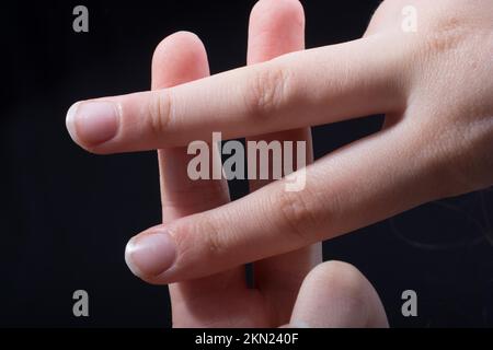 Fingers forming a hashtag symbol isolated on black background Stock ...