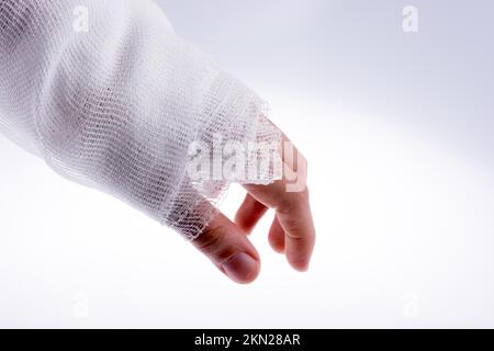 Hand wrapped in white bandage on a white background Stock Photo - Alamy