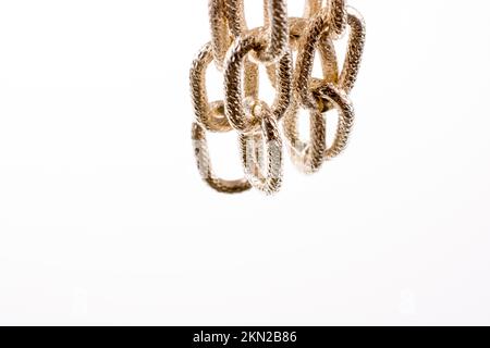 Gold color metal chain on white background Stock Photo - Alamy