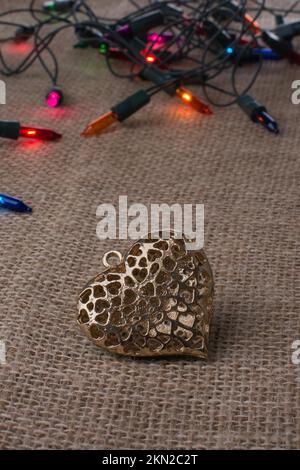 Christmas lights behind heart shaped object Stock Photo - Alamy