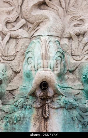 Sculptures, colored verdigris, representing water-spitting fish from ...