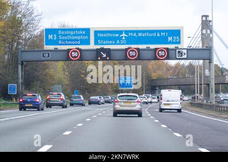 Gantry signs above M25 Motorway at Junction 27 for M11 routes with ...