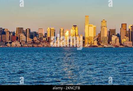 Sunlight reflects from buildings of the Seattle skyline in Washington ...