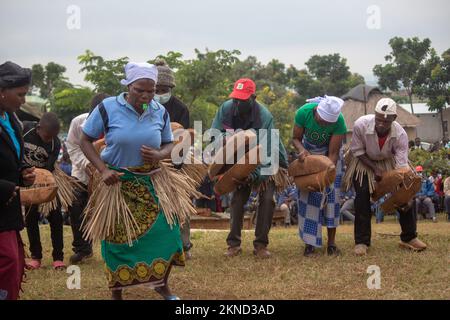 Exotic traditional musicians playing big self made traditional wooden ...