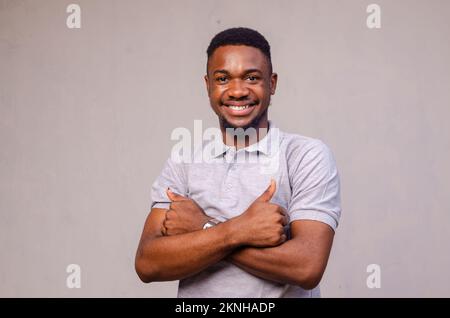 Young handsome business man with afro hair wearing elegant shirt ...