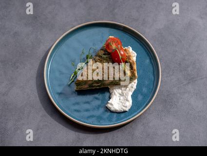 Round PIE with spinach and fish. Sliced Savory quiche with salmon and ...