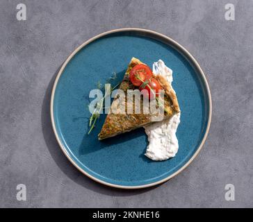 Round PIE with spinach and fish. Sliced Savory quiche with salmon and ...