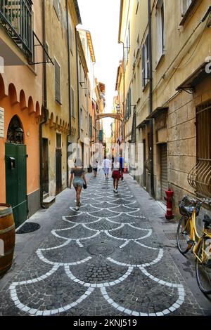 a Vertical shot of narrow streets Carrugi typical of Ligurian Riviera ...