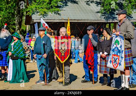 People carry tartan banners during the parade of clan tartans at the ...