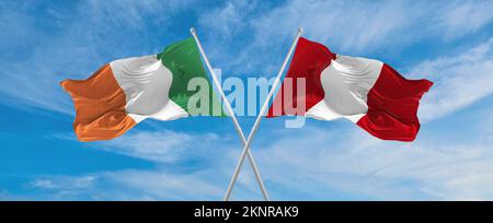 Peru and Ireland flag waving together in the wind on blue sky, two ...