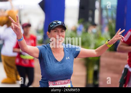 A woman running the International Marathon of Mexico city on the street ...