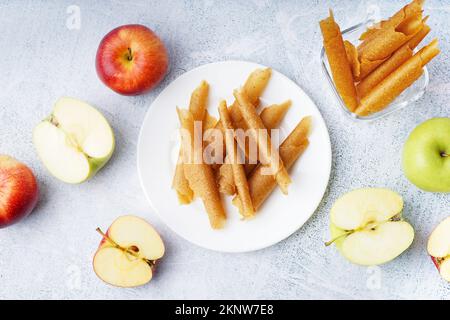 Plate with delicious apple pastilles on light background Stock Photo ...