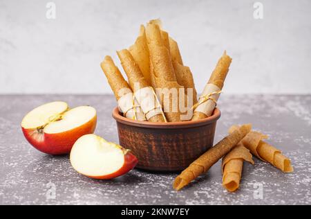 Bowl of tasty apple pastilles on red background Stock Photo - Alamy