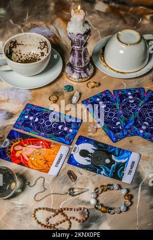 Magic attributes of soothsayer and tarot cards on table Stock Photo - Alamy