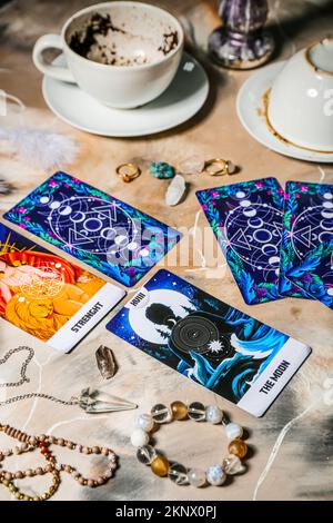 Magic attributes of soothsayer and tarot cards on table Stock Photo - Alamy