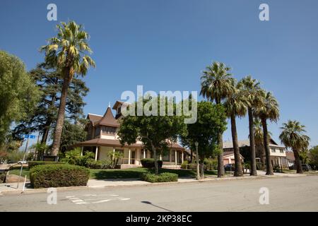 Palm tree framed view of historic downtown Colton, California, USA ...