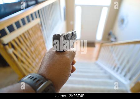 Prevent home invasion home protection with grey black hand gun Stock ...