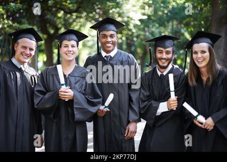 Portrait of diverse students graduates with diplomas Stock Photo - Alamy