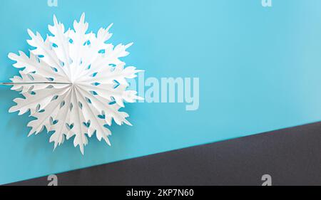 Volumetric paper snowflake on a colored background, flat lay Stock ...