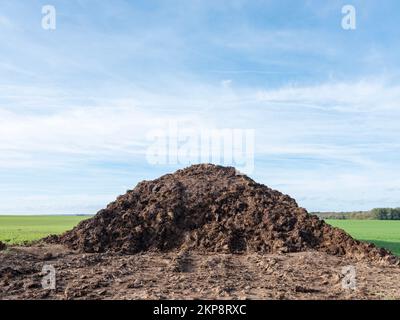 large heap of dung in belgian countryside between charlerois and ...
