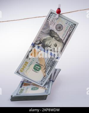 Banknote of US dollar hanging on a linen string Stock Photo - Alamy