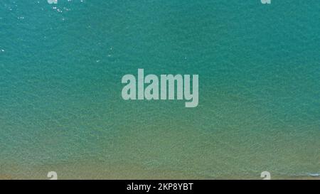 Slow motion of transparent water washing sandy shore of tropical island ...