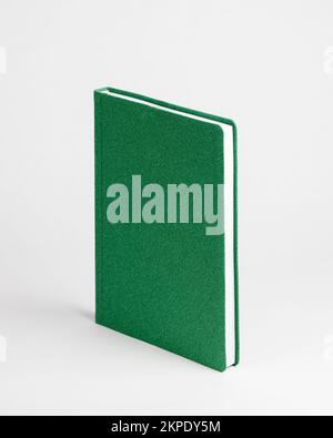 Mockup of closed craft notebook with white band, textured hard cover ...