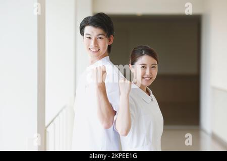 Smiling young Japanese nurses posing in the hallway Stock Photo - Alamy