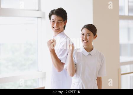 Smiling young Japanese nurses posing in the hallway Stock Photo - Alamy