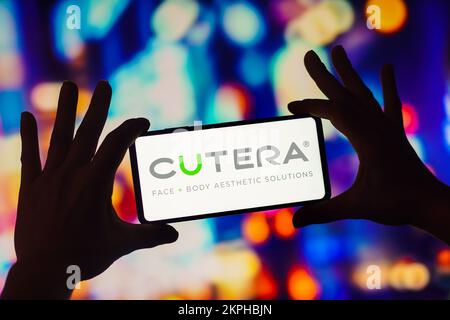 In this photo illustration the Cutera logo seen displayed on a ...