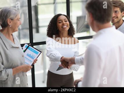 Conversation between managers and employees in the office Stock Photo ...