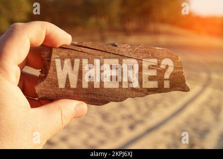 Business and miscellaneous concept. A man holds a sign in his hands ...