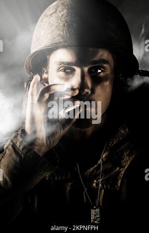 Army soldier smoking cigarette at night Stock Photo - Alamy