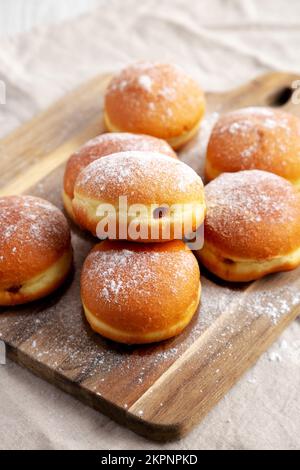 Homemade Apricot Polish Paczki Donut with Powdered Sugar on a Wooden ...