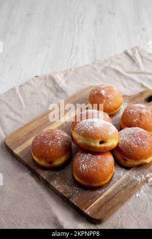 Homemade Apricot Polish Paczki Donut with Powdered Sugar on a Wooden ...