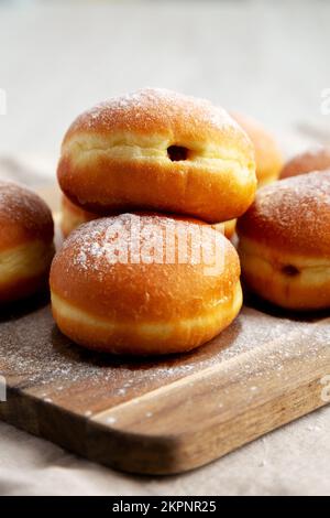 Homemade Apricot Polish Paczki Donut with Powdered Sugar on a Wooden ...